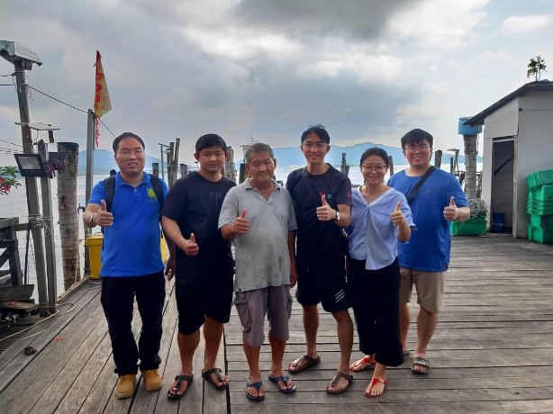 Group photo with fish farm owner Mr Chow Cha Leng (third from left) at Pangkor Island after the ...
